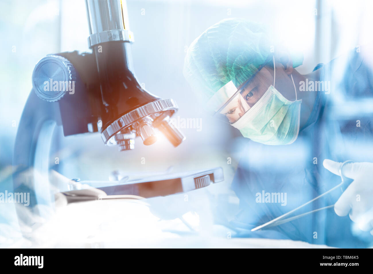 Medical laboratory microscope with Asian surgery doctor in operation ...