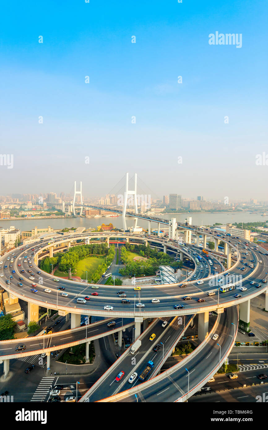 Skyline and road intersection at sunset Stock Photo - Alamy