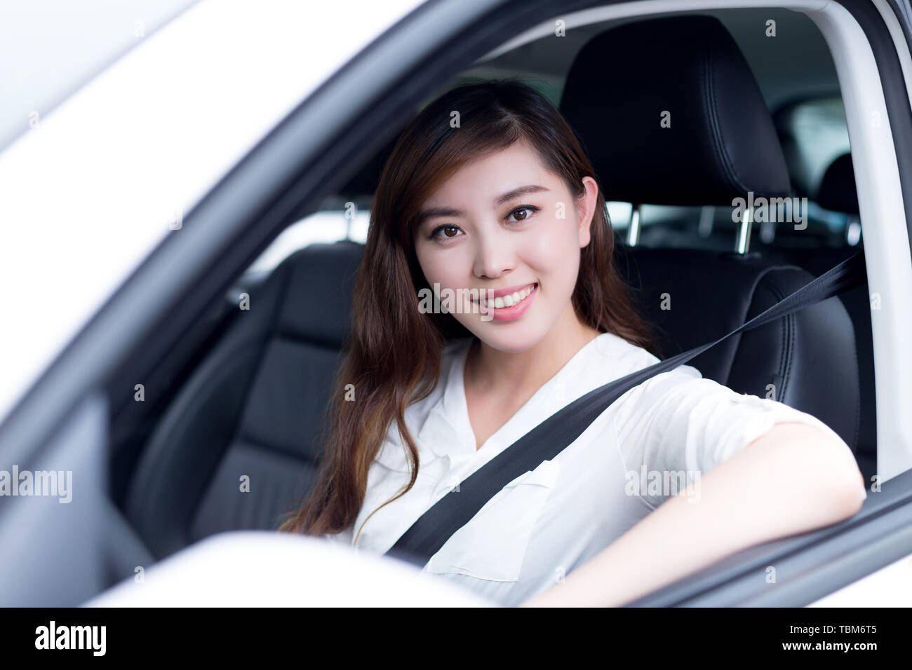 Asian beautiful woman driving car portrait Stock Photo - Alamy