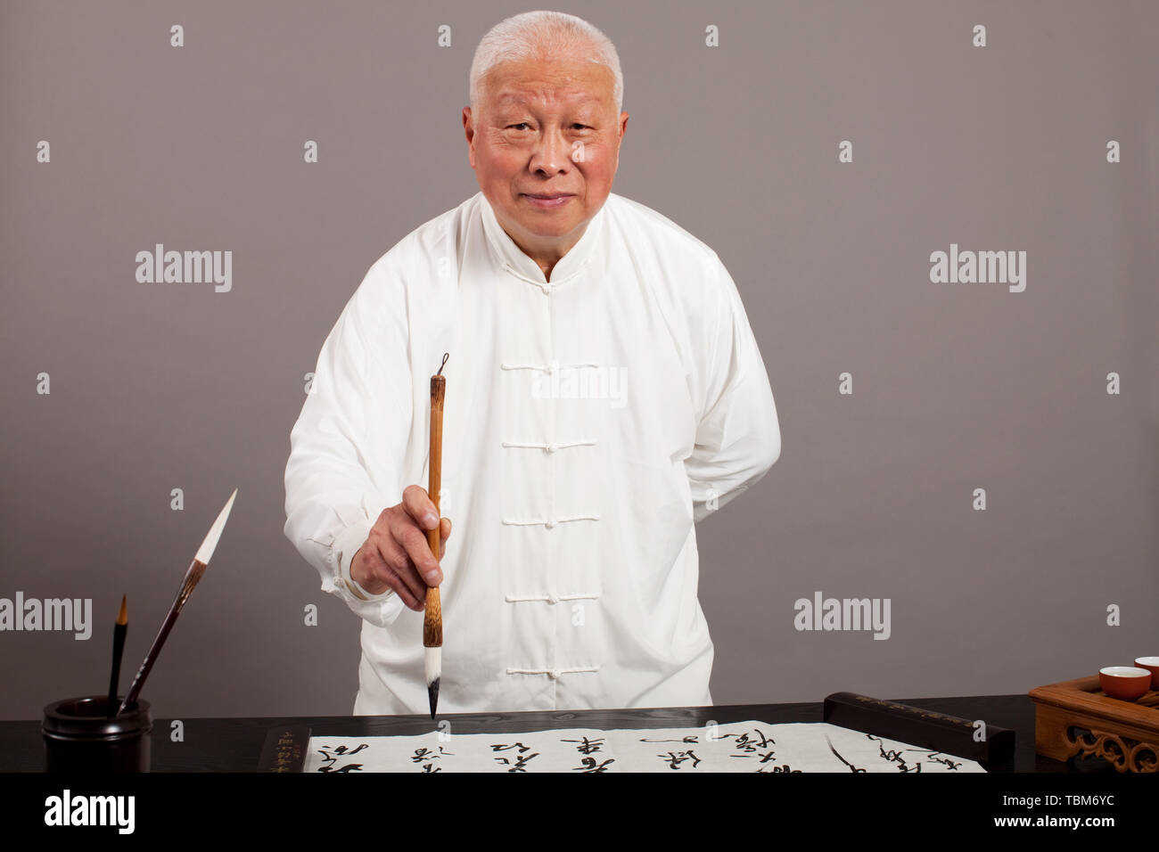 Elderly man practicing calligraphy hi-res stock photography and images ...
