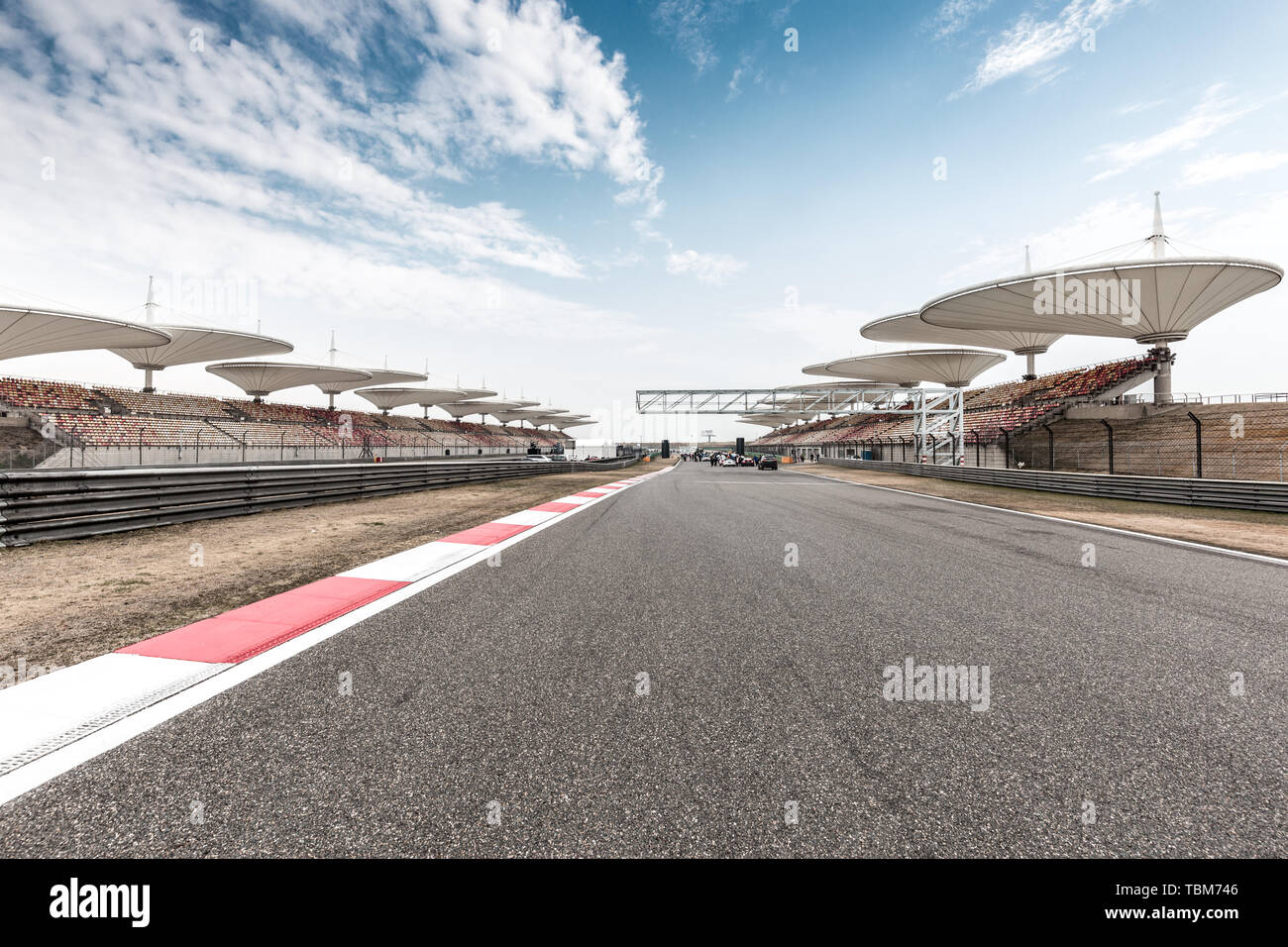 Empty asphalt road in car track Stock Photo - Alamy