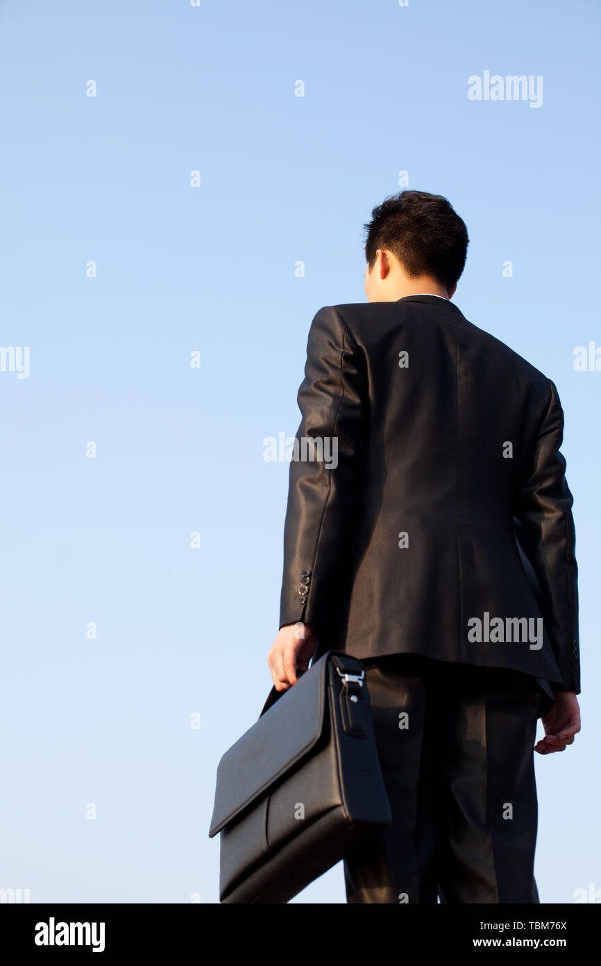 Shadow man holding briefcase hi-res stock photography and images - Alamy