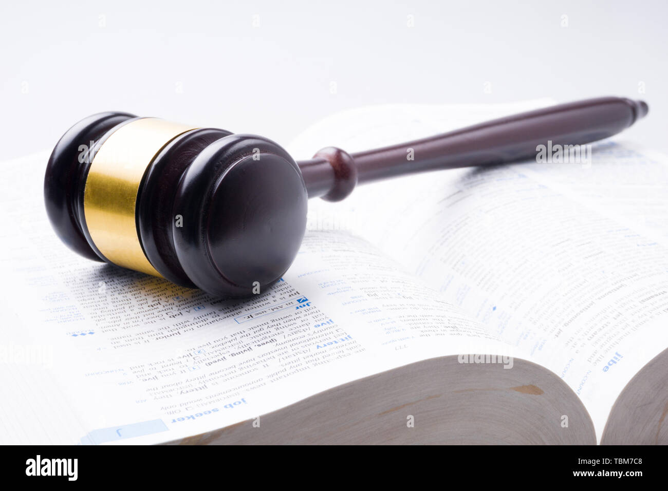 Judge hammer lay on book Stock Photo - Alamy