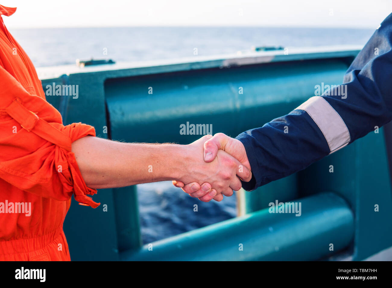marine contractor businessman handshaking with worker on the ship Stock ...