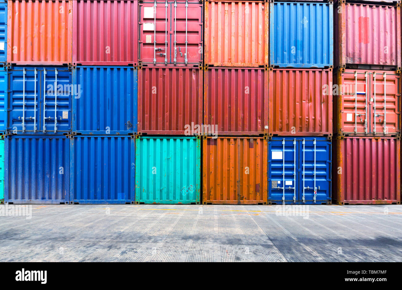 stack of containers with empty road in front Stock Photo - Alamy