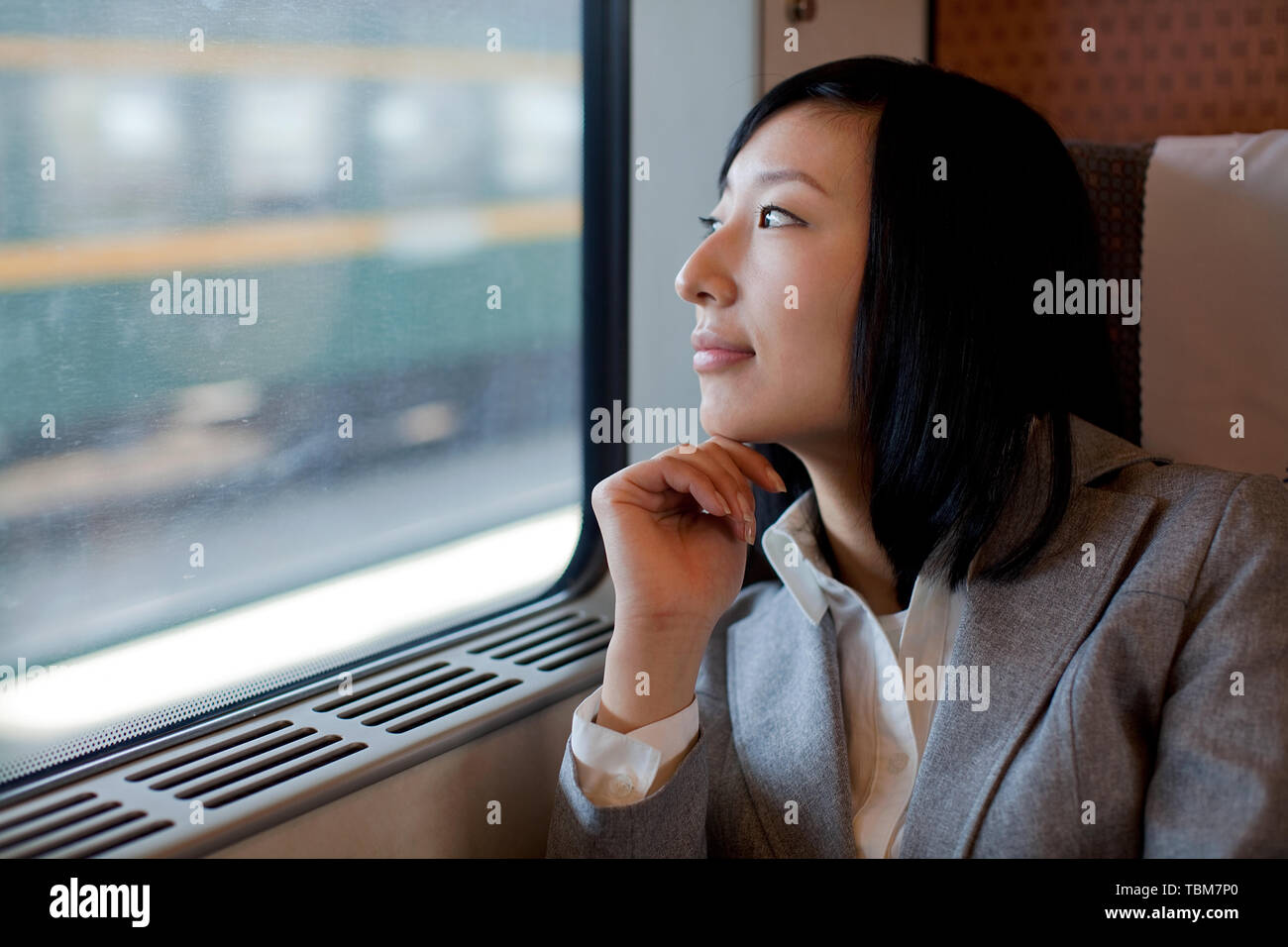 A business person on a train Stock Photo - Alamy