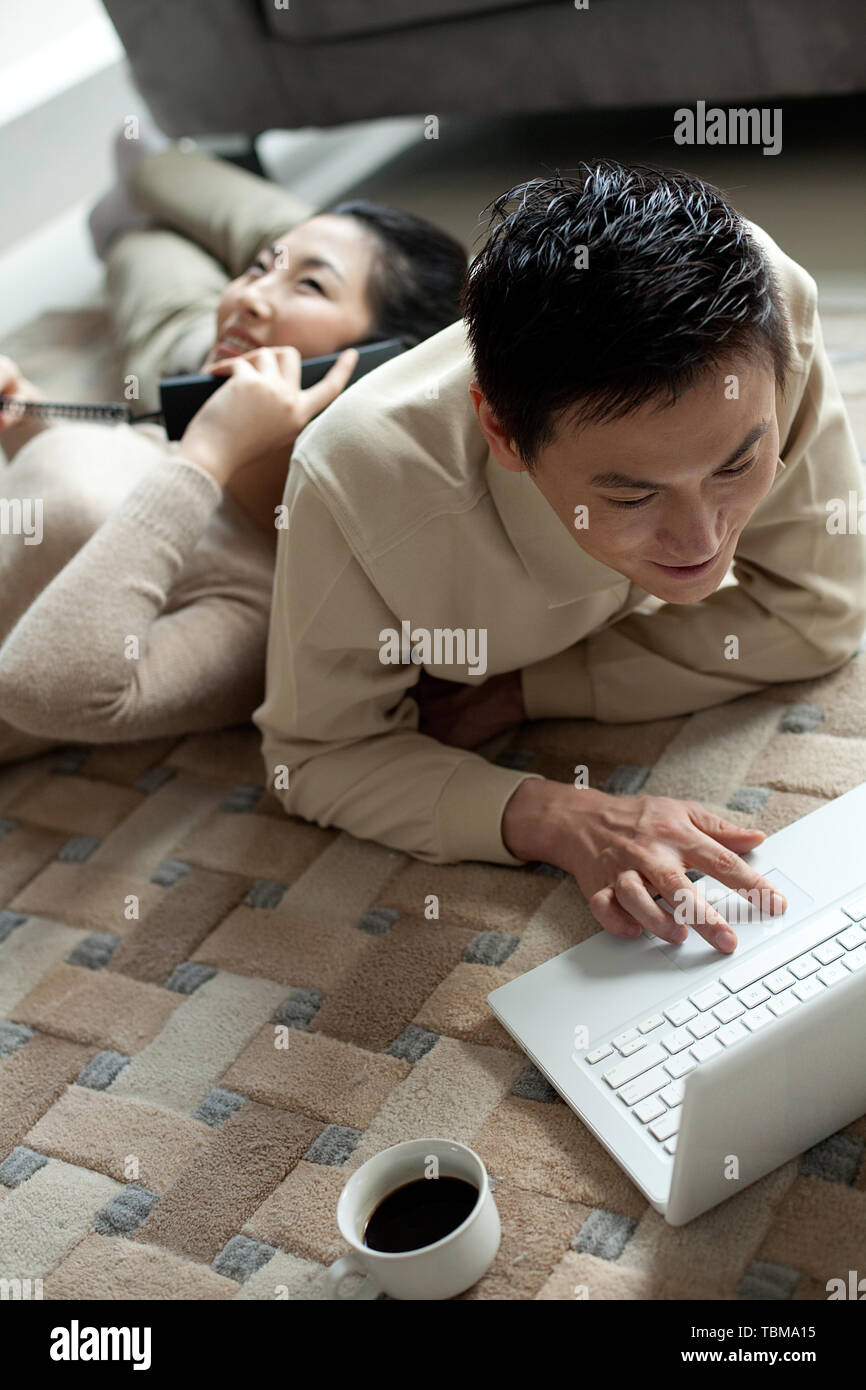 A couple snuggled up together Stock Photo - Alamy