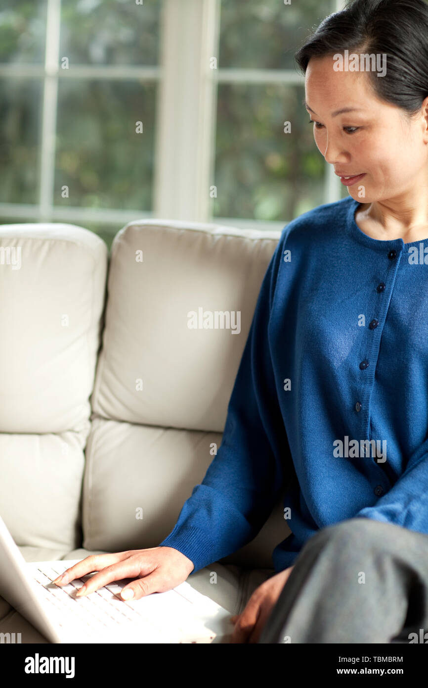 An elderly person using a laptop Stock Photo - Alamy