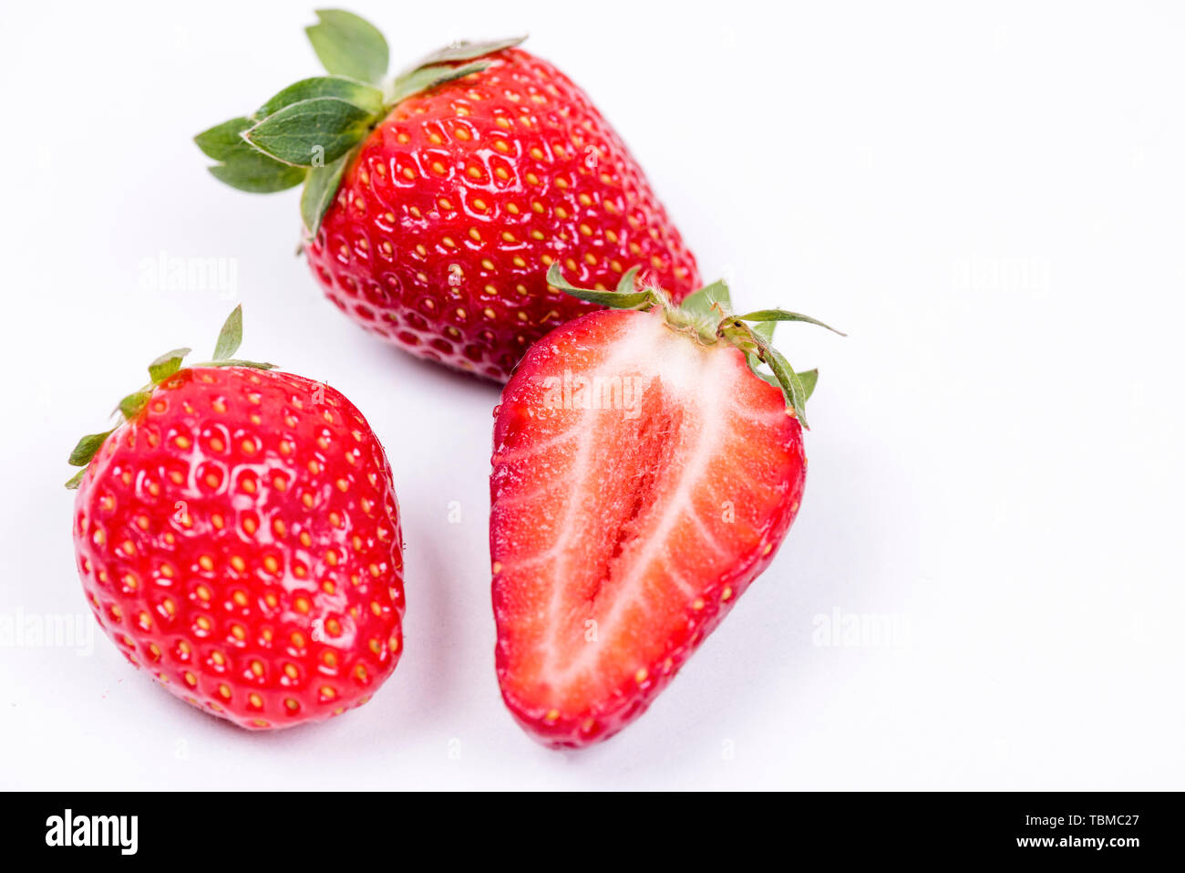 Red strawberry closeup on white background Stock Photo - Alamy