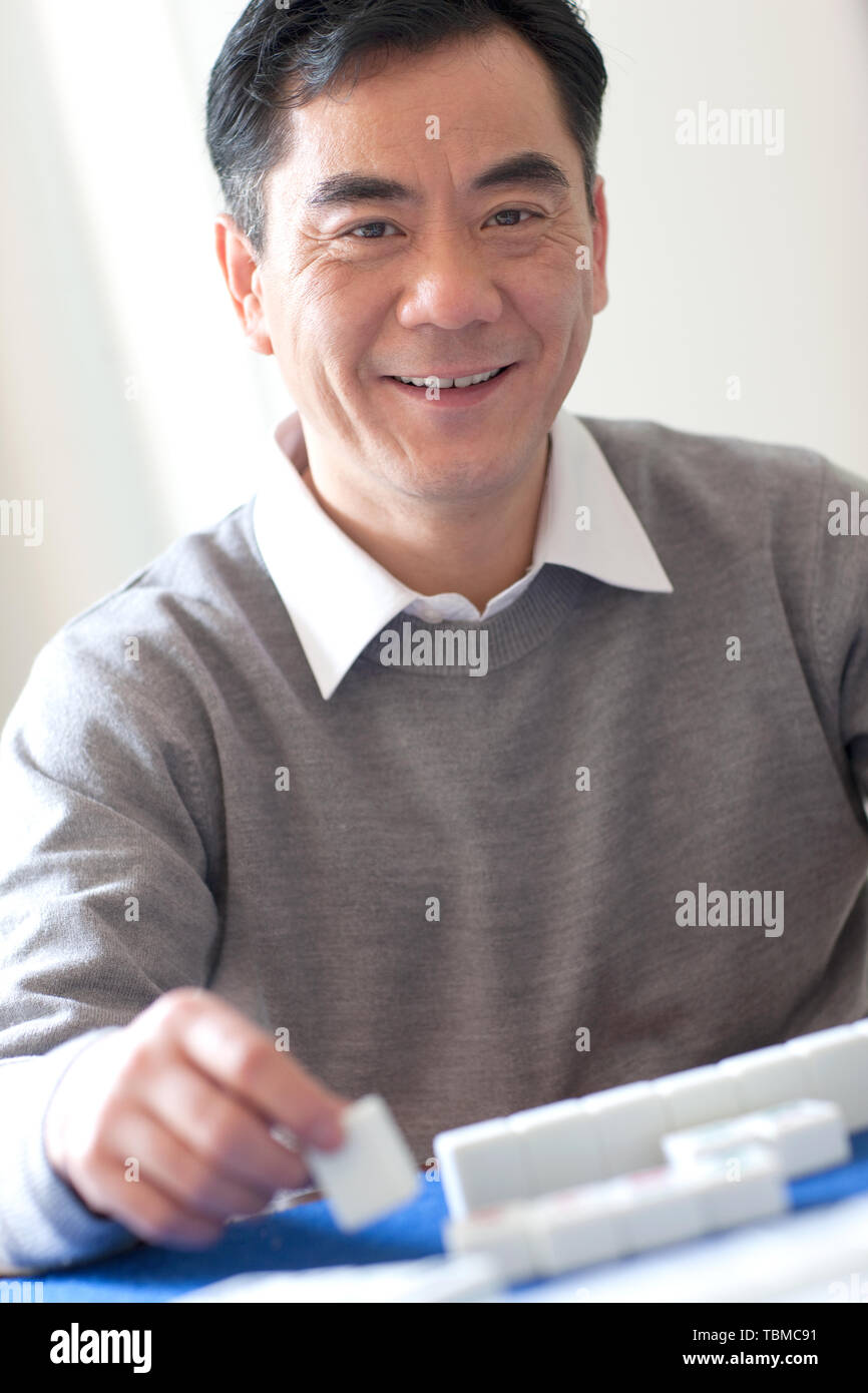 Old people play mahjong Stock Photo - Alamy