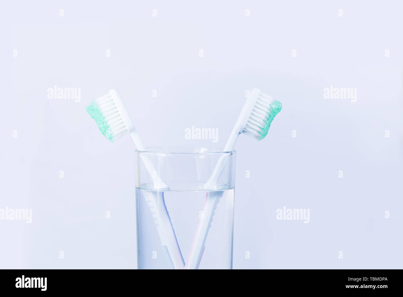 Toothbrush, toothpaste, glass Stock Photo - Alamy