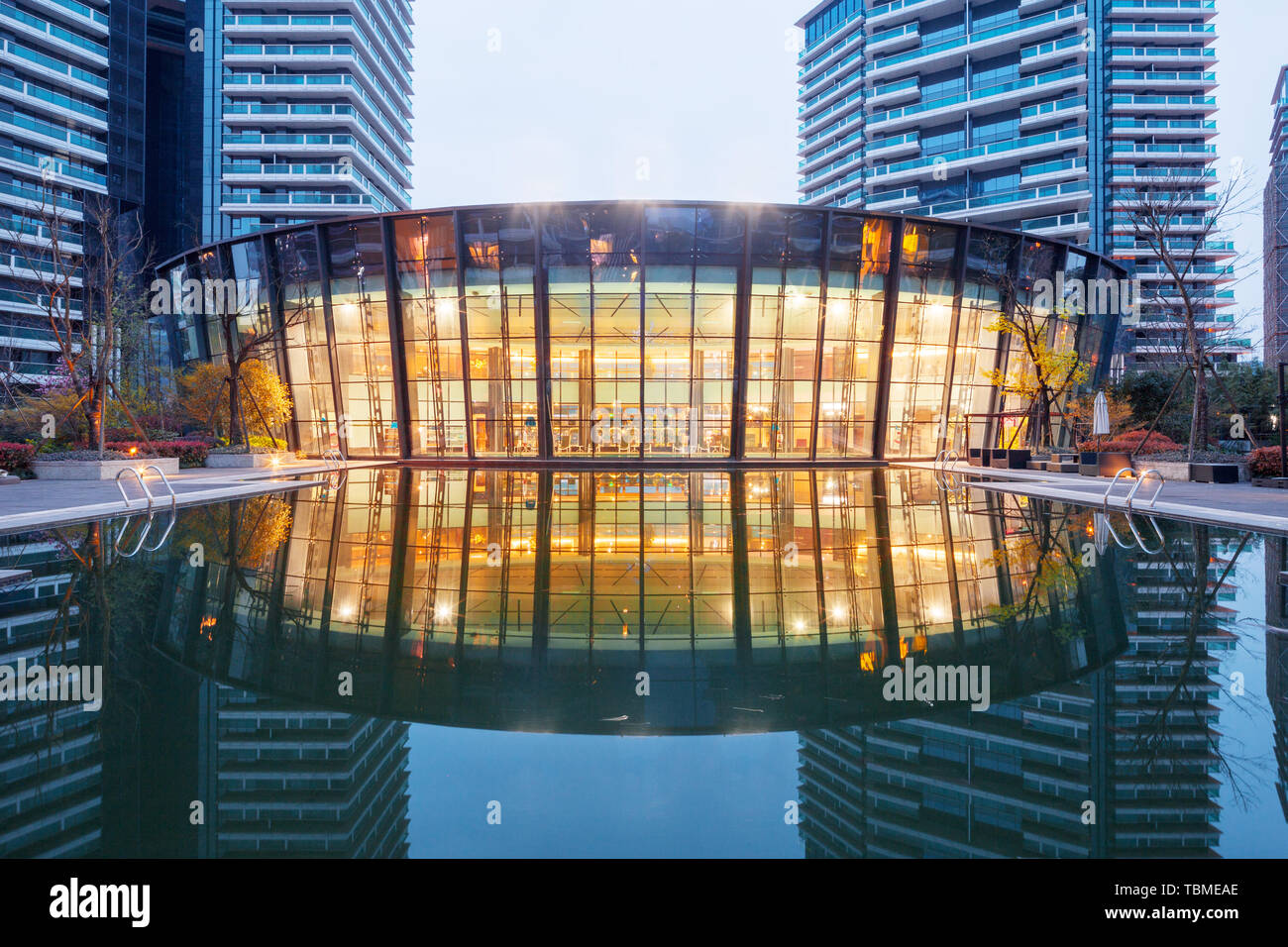 modern office buildings near water at twilight Stock Photo - Alamy