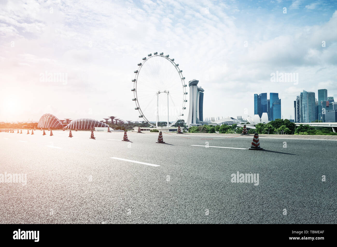 empty road with modern buildings and ferris wheel Stock Photo - Alamy