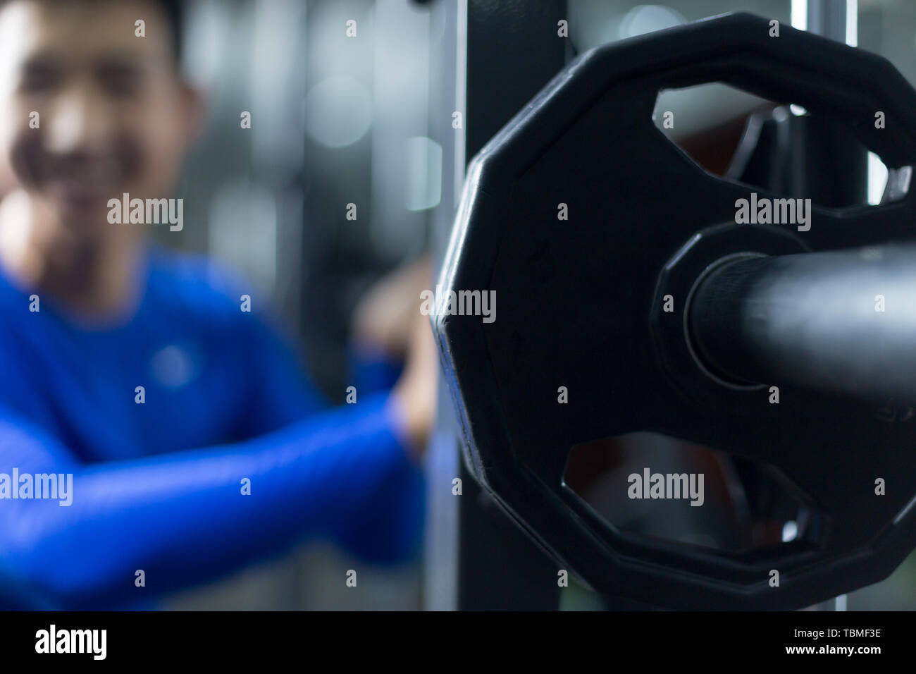 young asian man working out in modern gym Stock Photo - Alamy