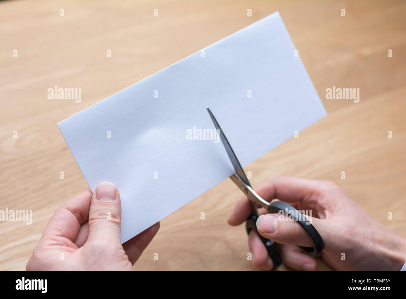 Topping cutting paper by scissors Stock Photo - Alamy