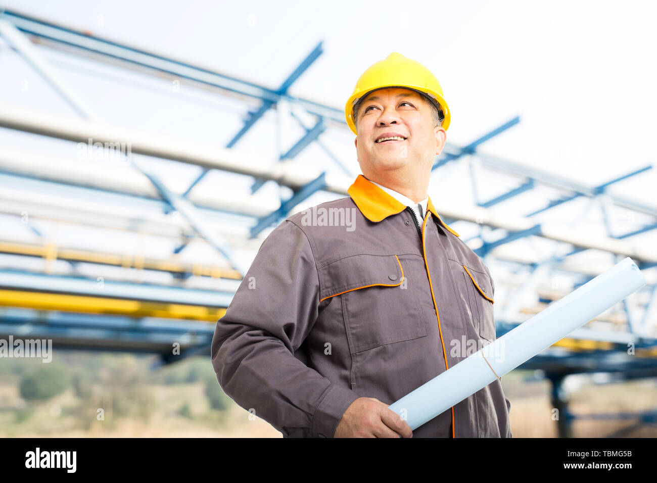 old chinese man engineer in oil refinery plant Stock Photo - Alamy
