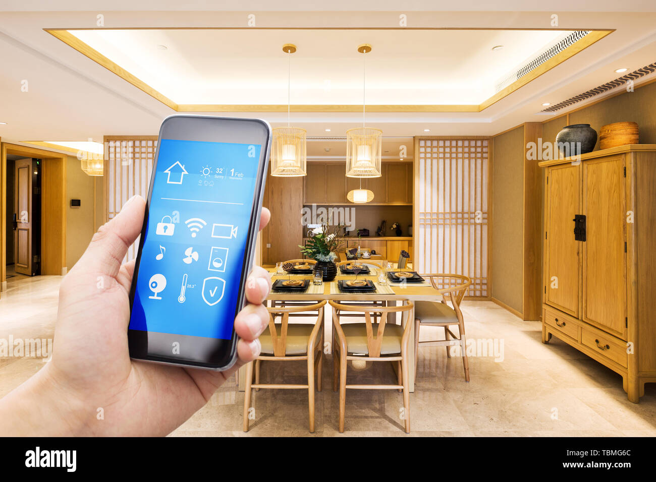 smart phone with smart home with modern dining room Stock Photo - Alamy
