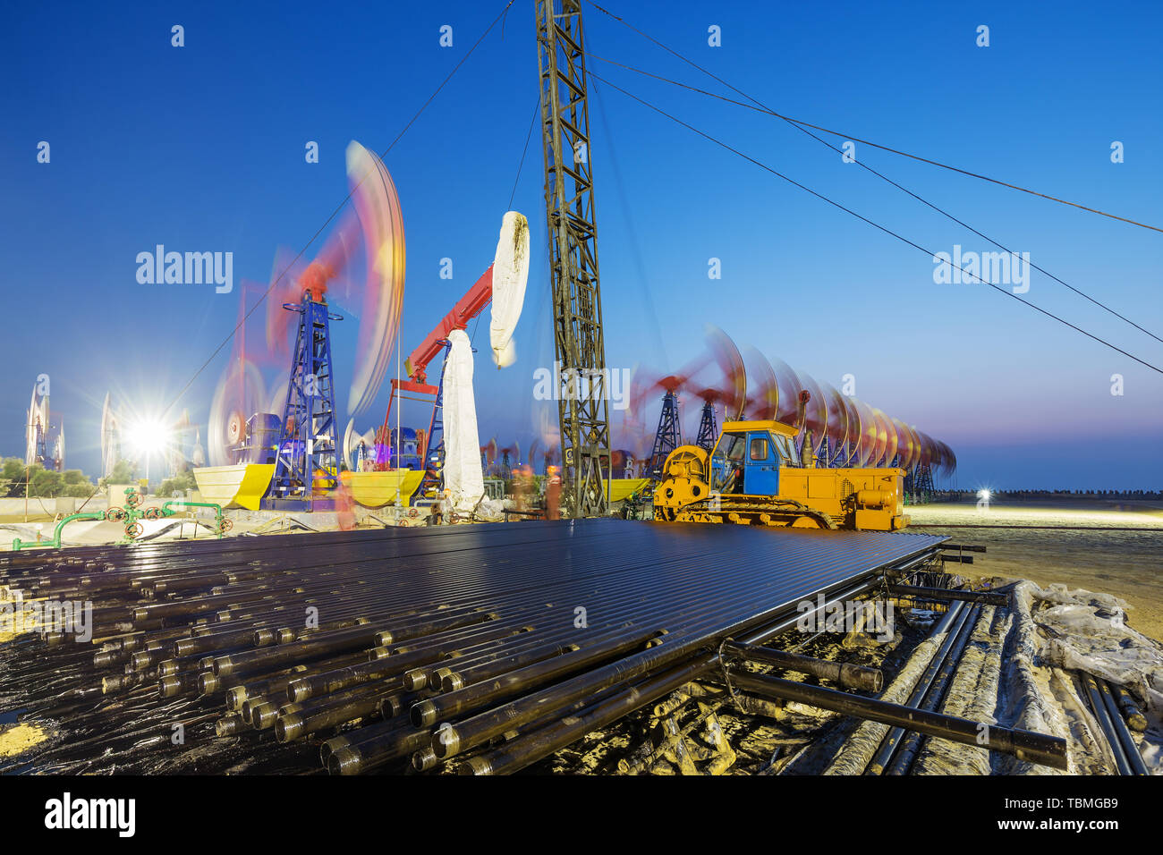 working oil-rig of oilfield day and night Stock Photo - Alamy