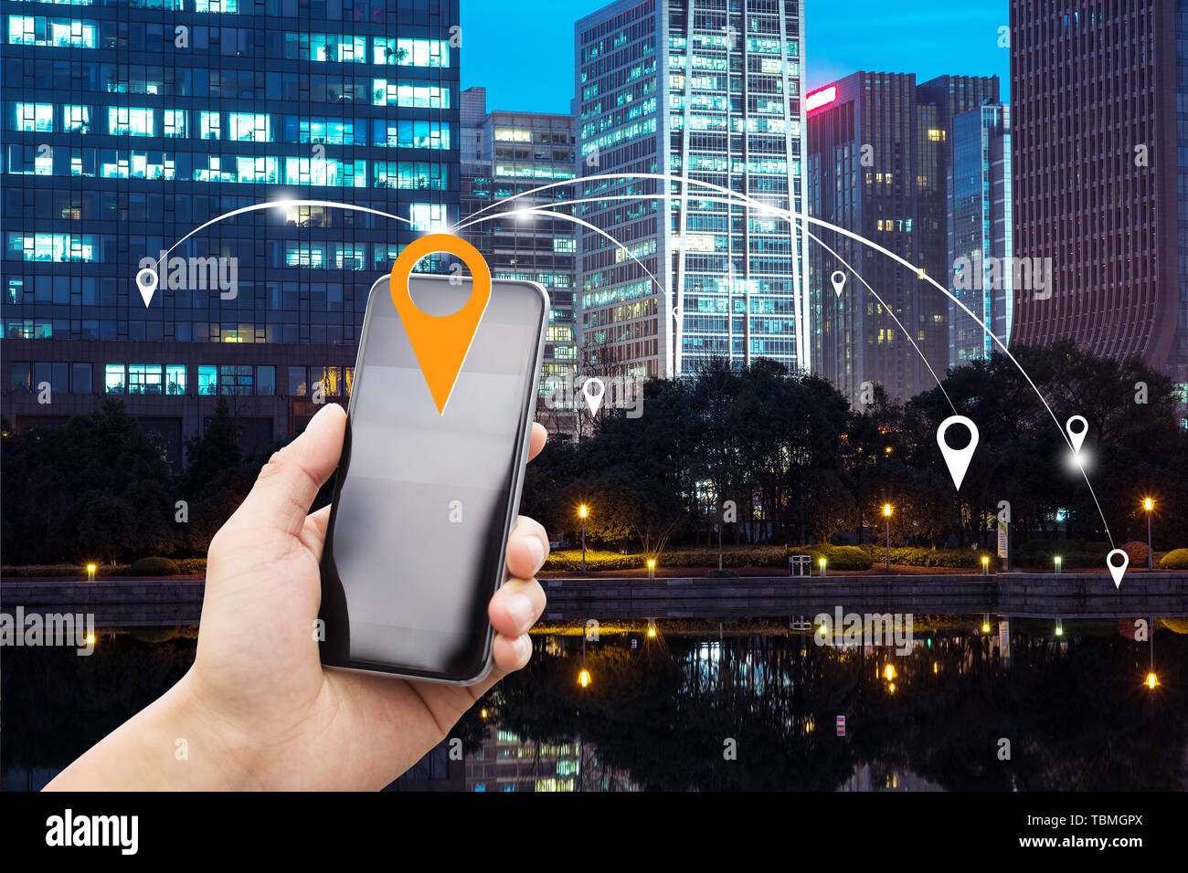 mobile phone with modern intelligence buildings at night Stock Photo ...