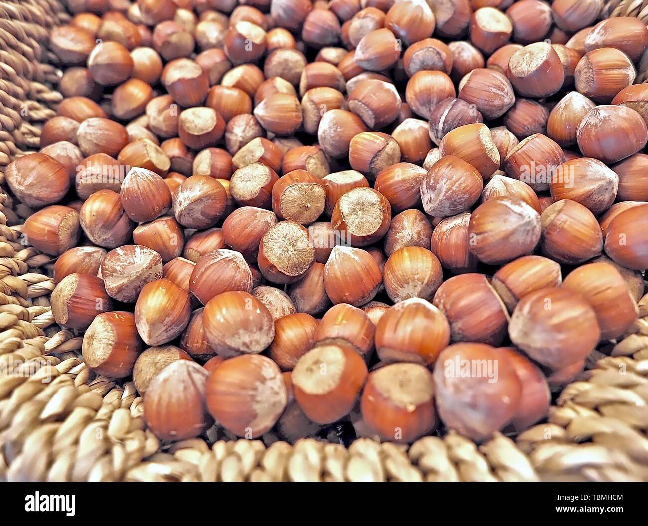 Macro of hazelnuts in a basket at a food market Stock Photo - Alamy