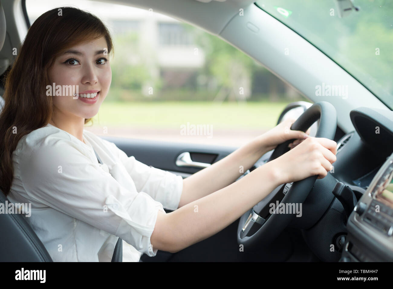 young beautiful asian girl in car Stock Photo - Alamy
