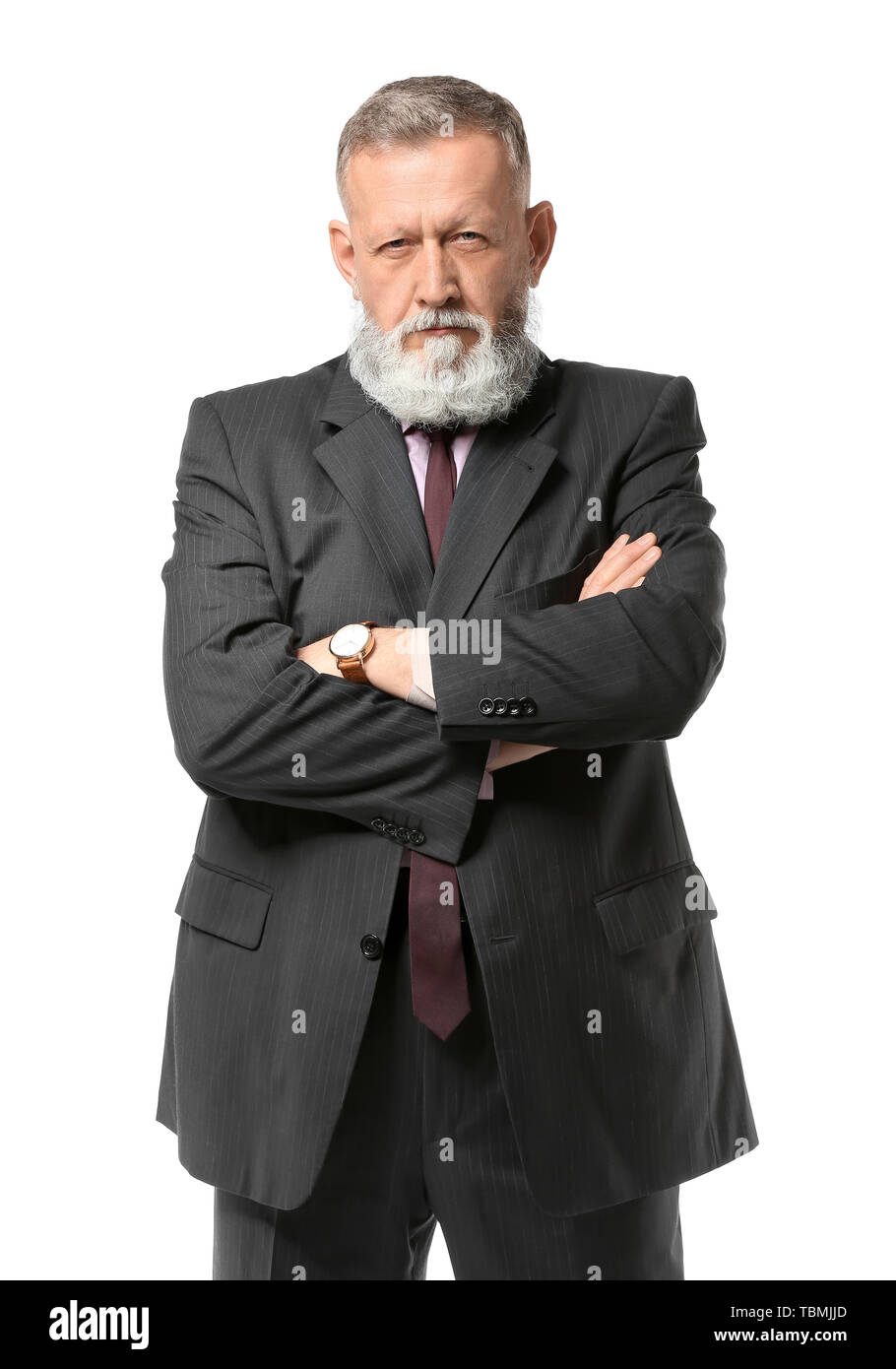 Suspicious mature businessman on white background Stock Photo - Alamy