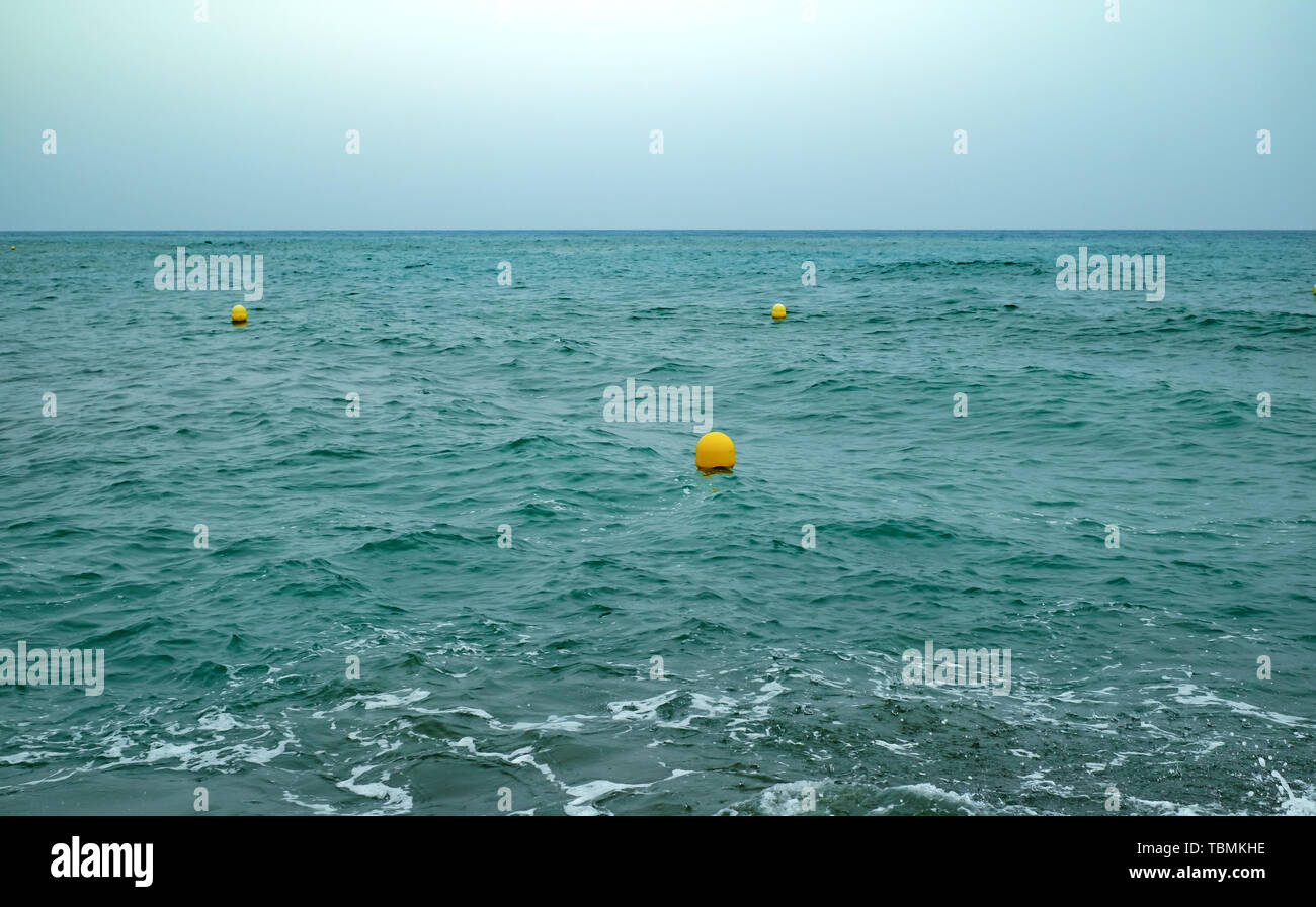 yellow buoys at clear sea Stock Photo - Alamy