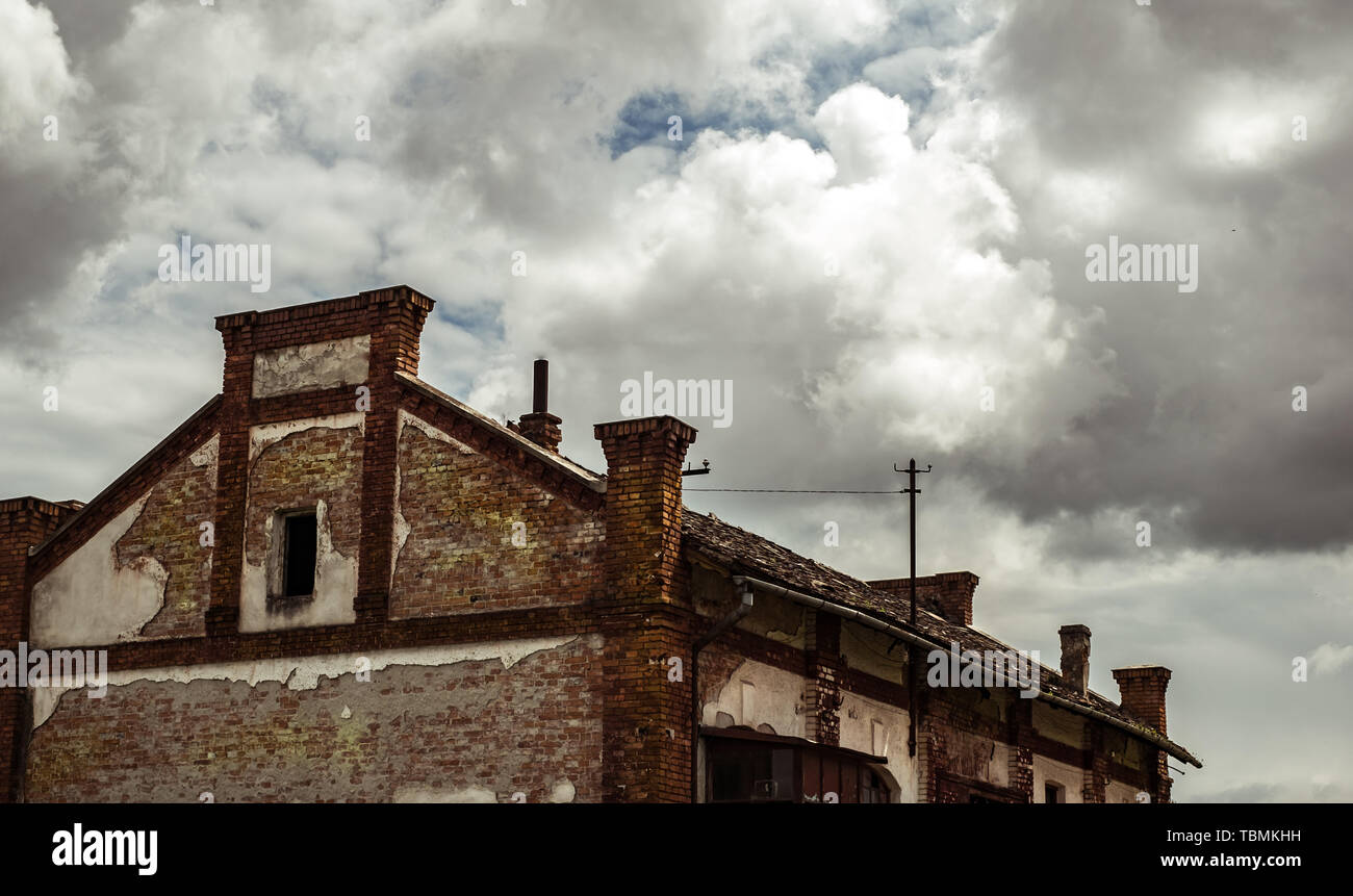 abandoned factory warehouse with broken windows and plaster fallen ...