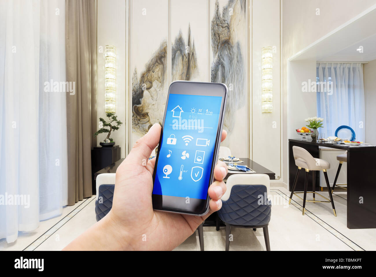 smart phone with smart home with modern dining room Stock Photo - Alamy