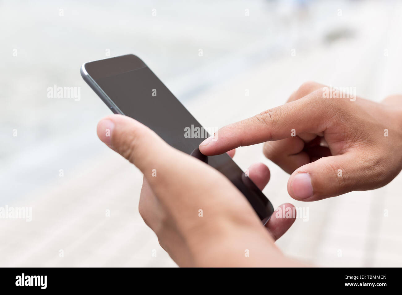 hand holding mobile phone with cityscape as background Stock Photo - Alamy