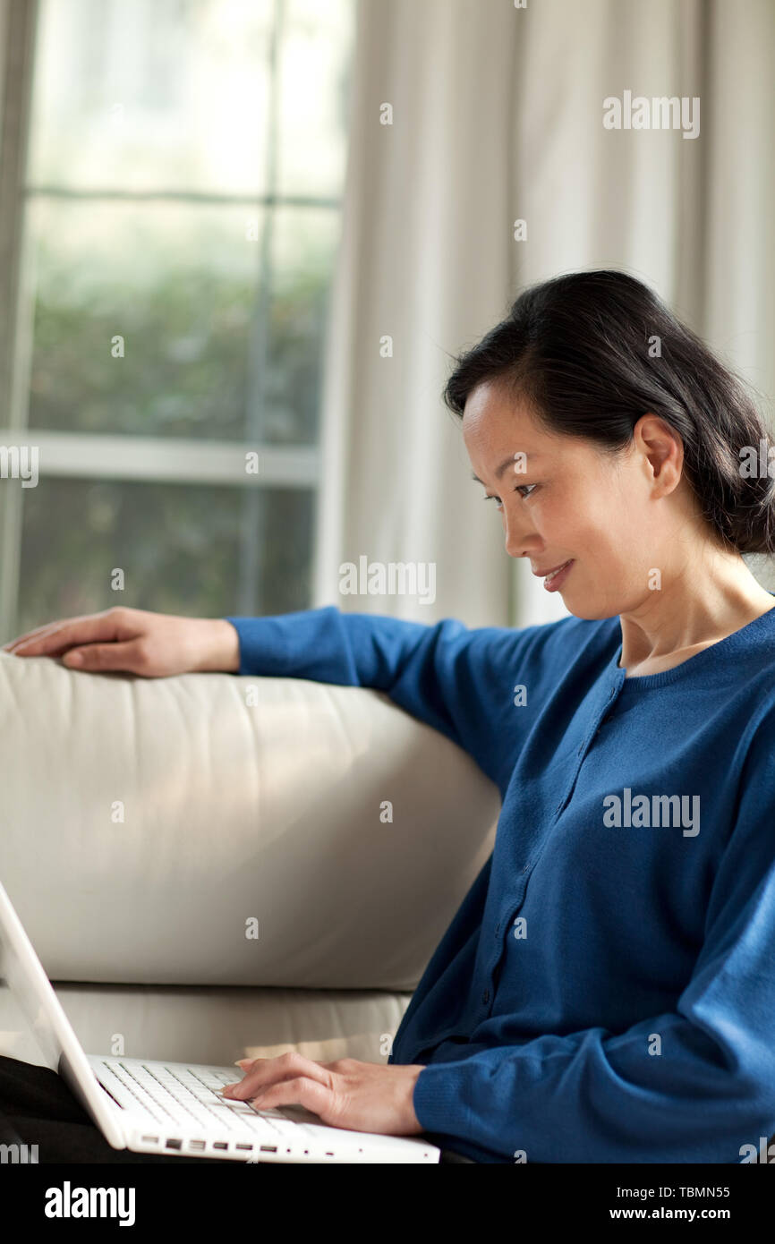 An elderly person using a laptop Stock Photo - Alamy