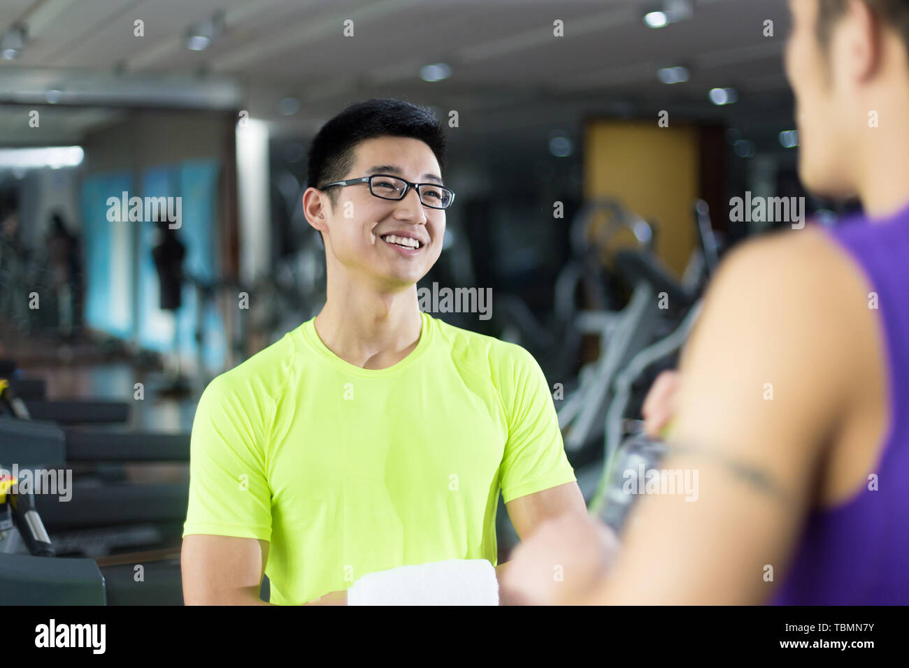 young asian people talking in modern gym Stock Photo - Alamy