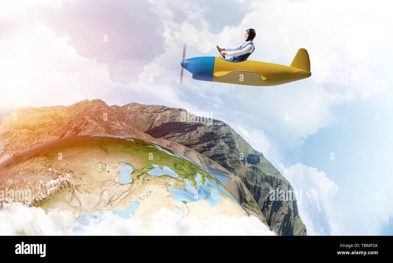 Happy pilot driving small propeller plane Stock Photo - Alamy