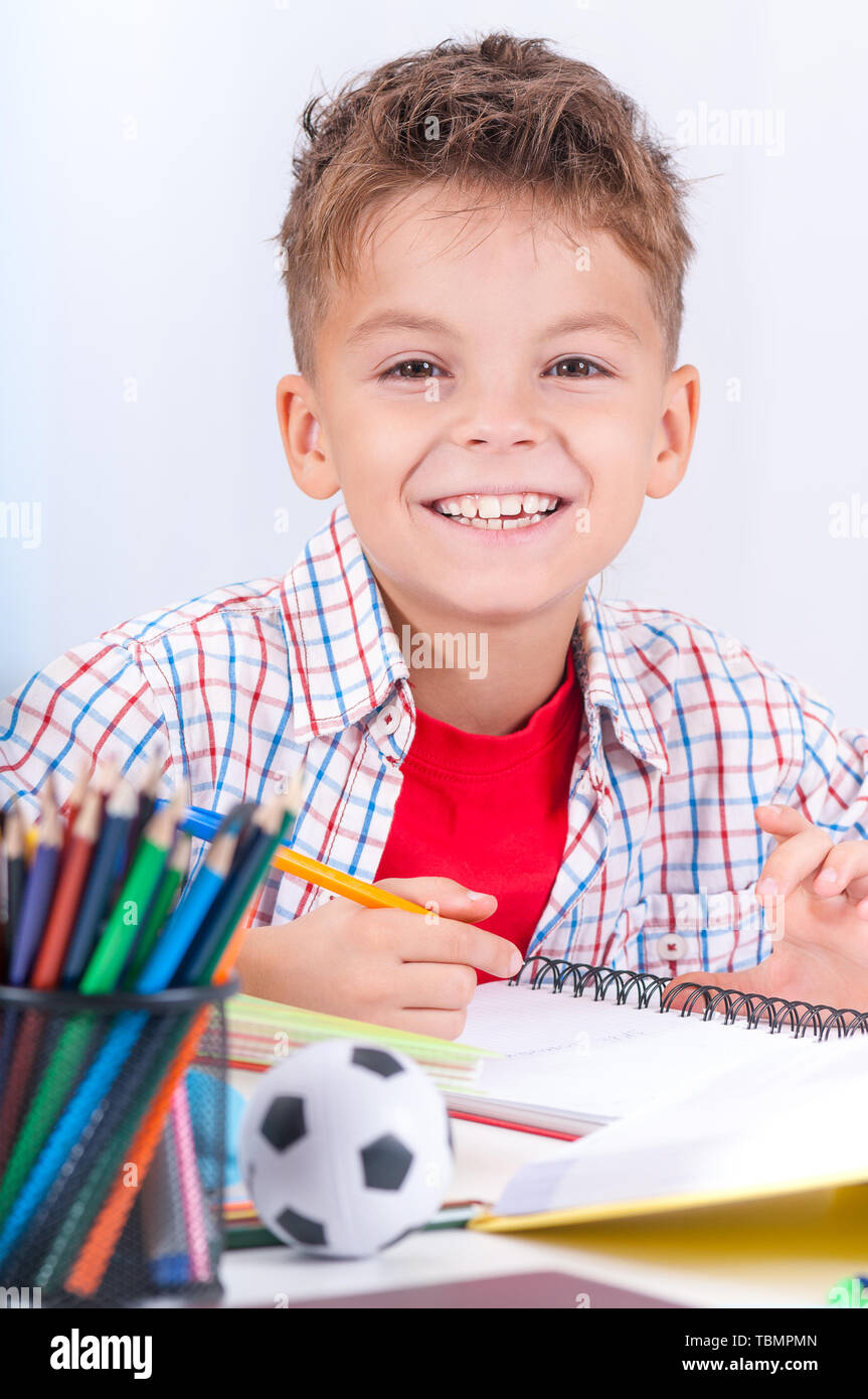 Boy doing homework at desk Stock Photo - Alamy