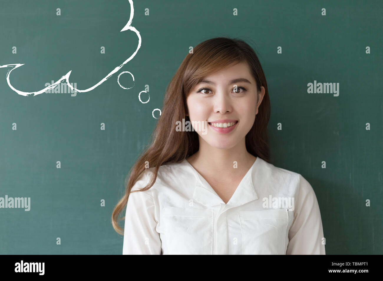beautiful girl teacher with green blackboard Stock Photo - Alamy