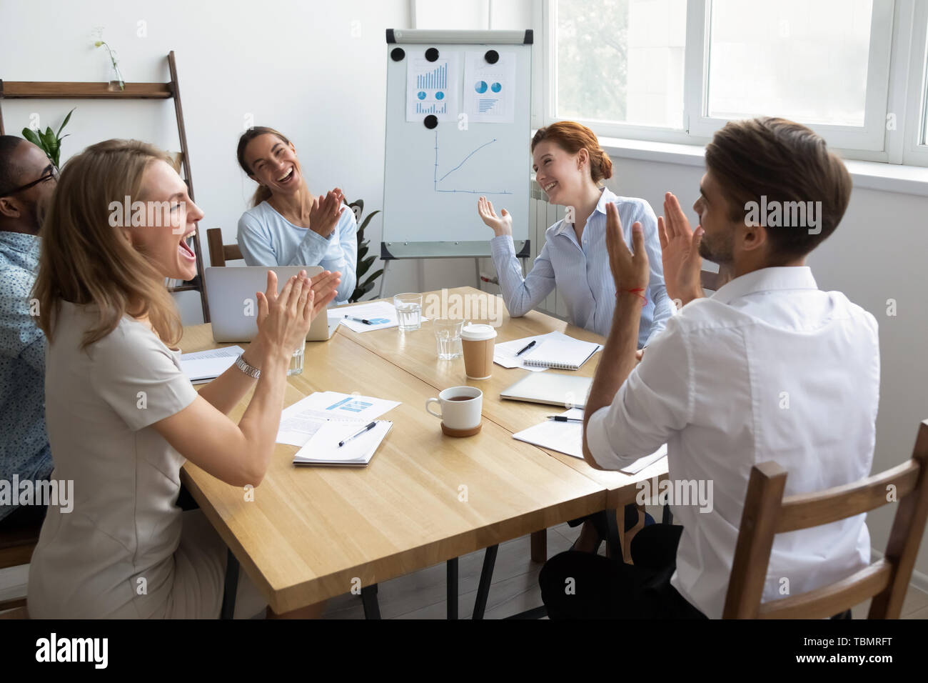 Diverse Office Workers Team Laughing And Applauding At Funny Joke Stock