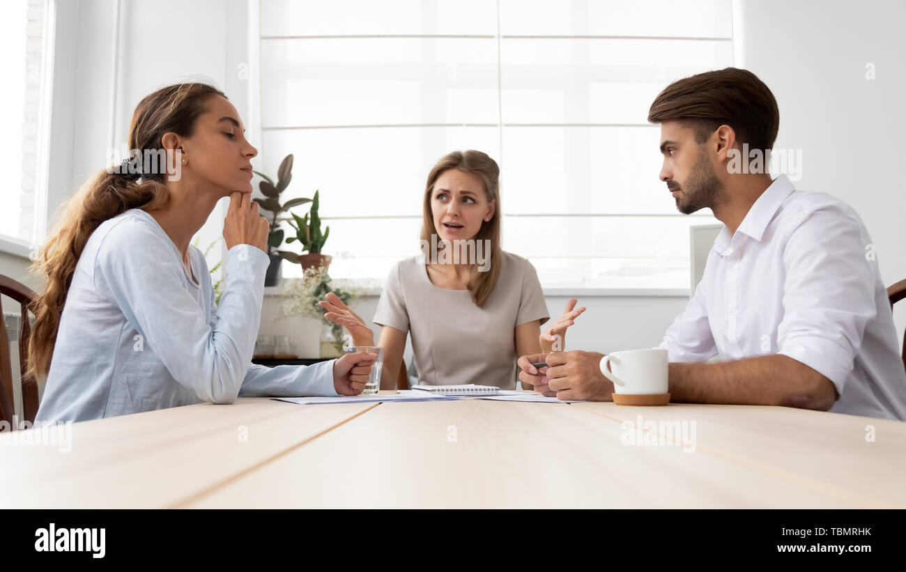 Angry furious female boss scolding employees for bad work Stock Photo ...