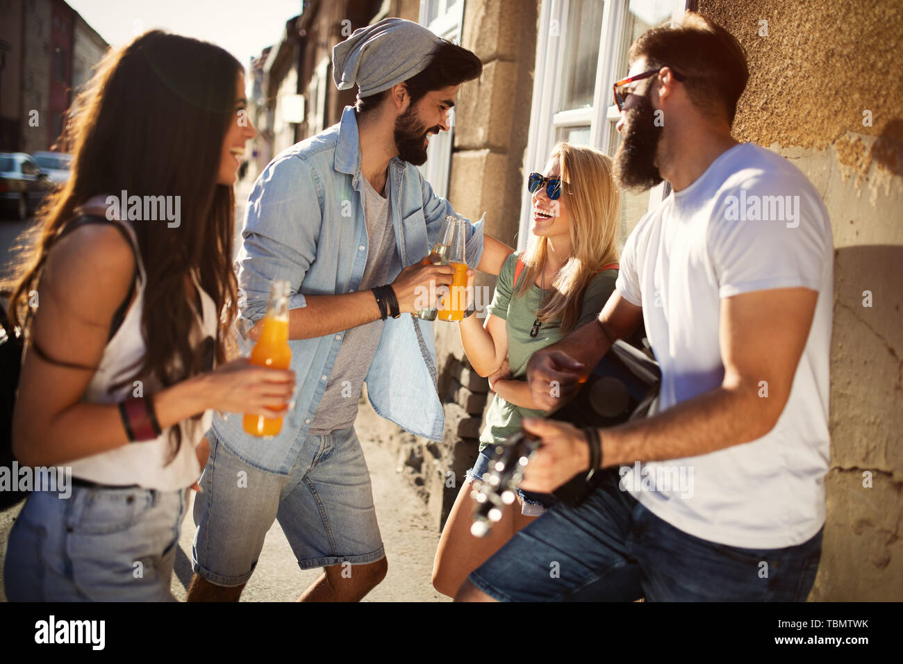 Group of friends hanging out, having fun and enjoying summer days Stock ...