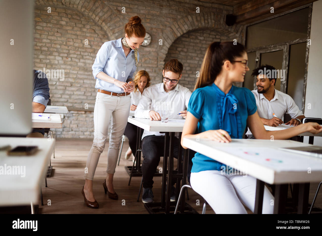 Successful happy group of people learning software engineering and ...