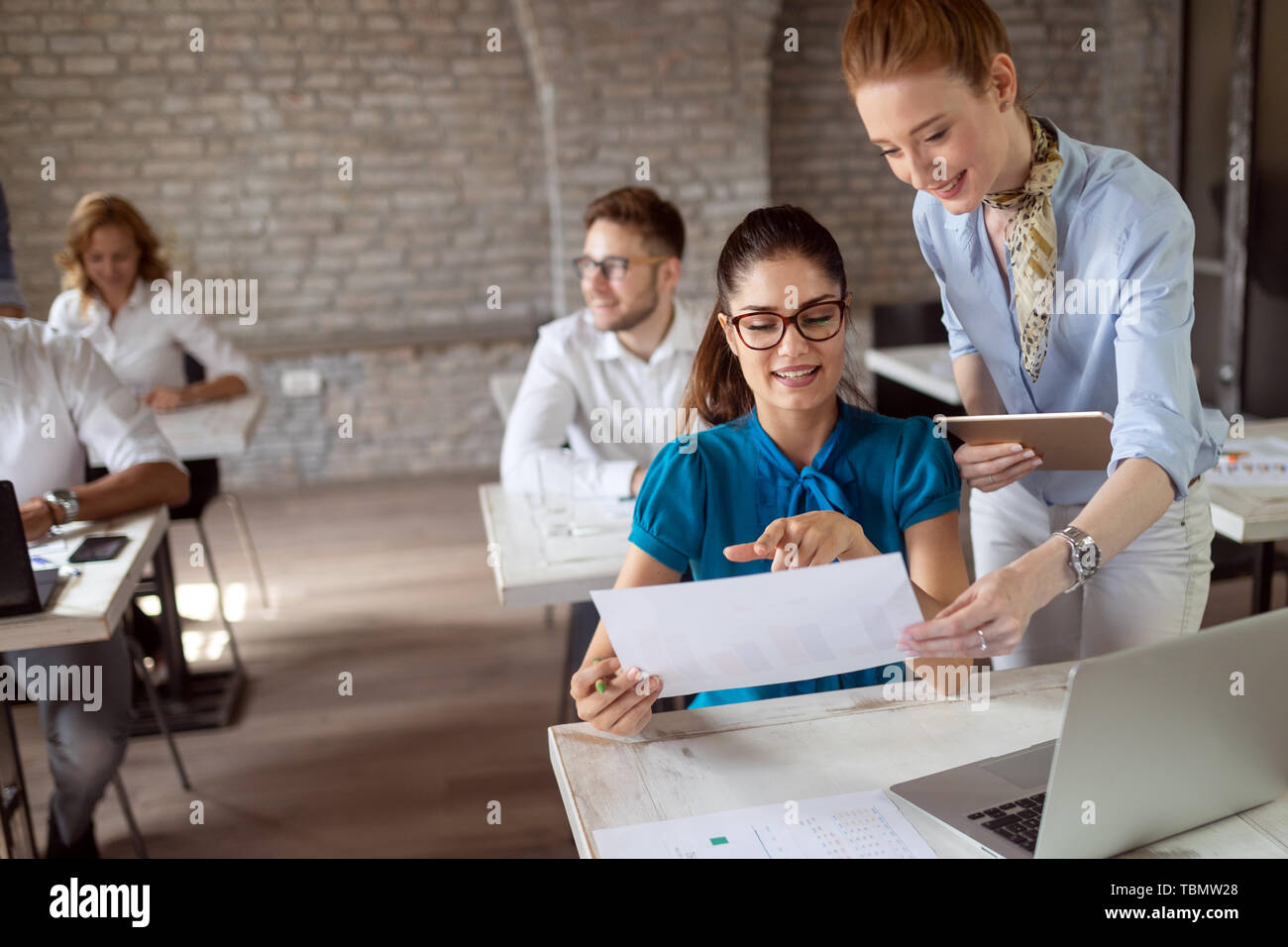 Successful happy group of people learning software engineering and ...