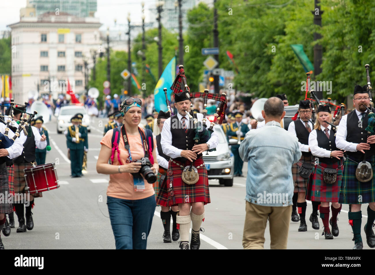 Military music bands marching through the empty streets of the city of ...