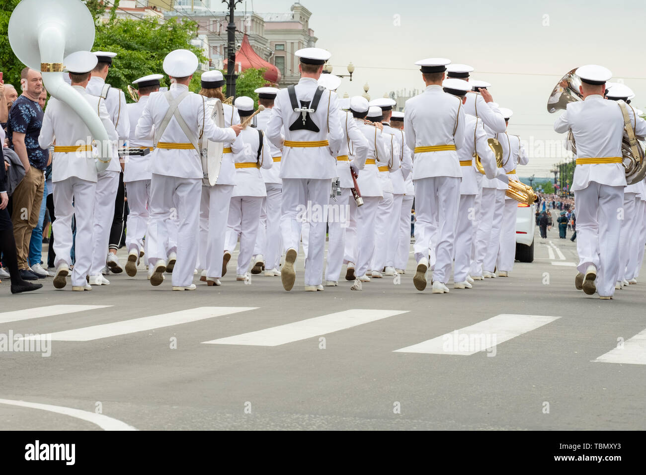 Military music bands marching through the empty streets of the city of ...