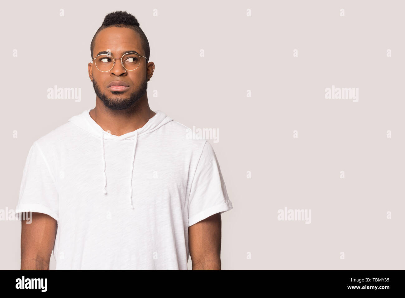 Smiling black man stand in profile isolated in studio Stock Photo - Alamy