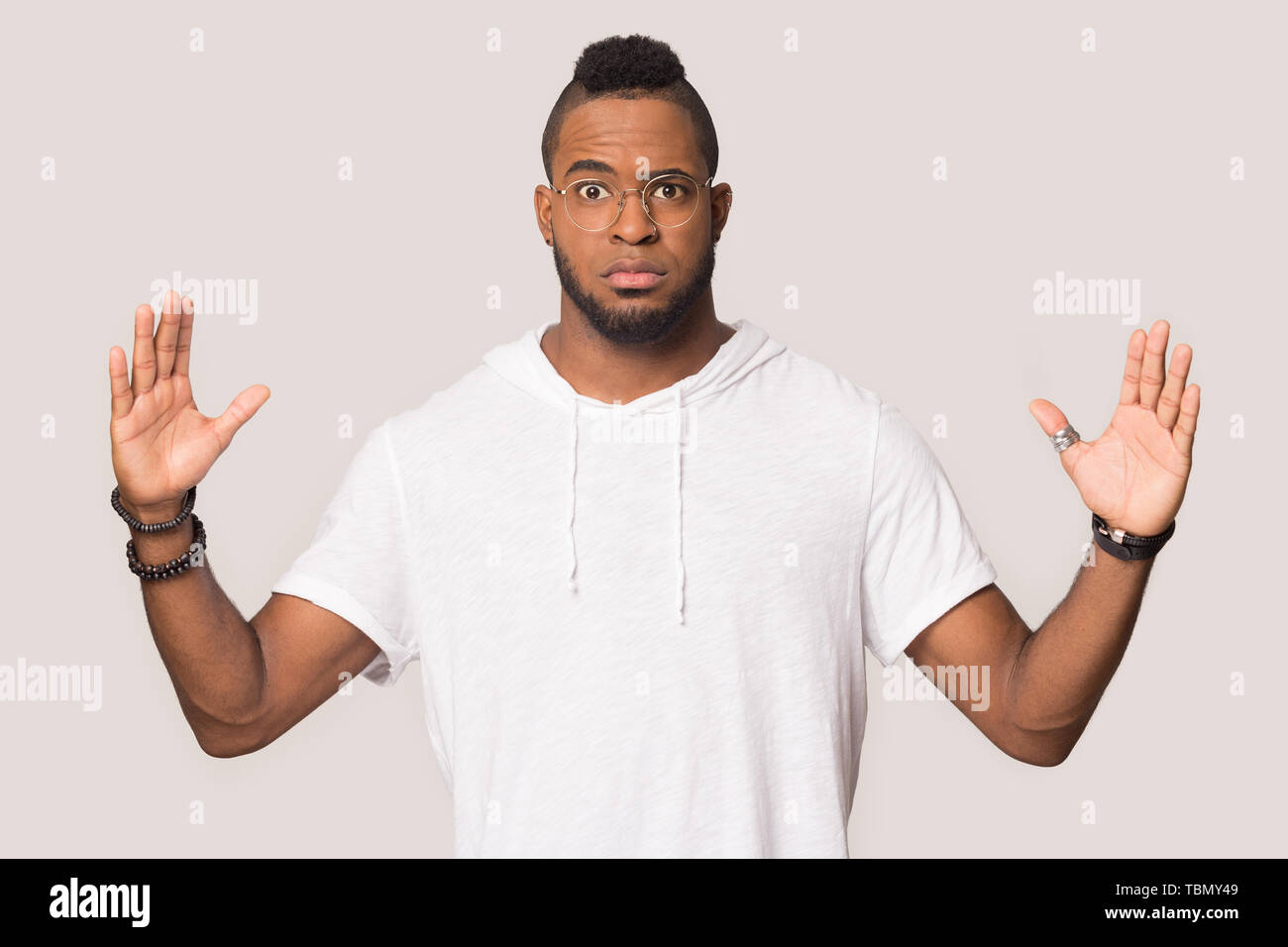 Upset black man look down thinking feeling sad Stock Photo - Alamy