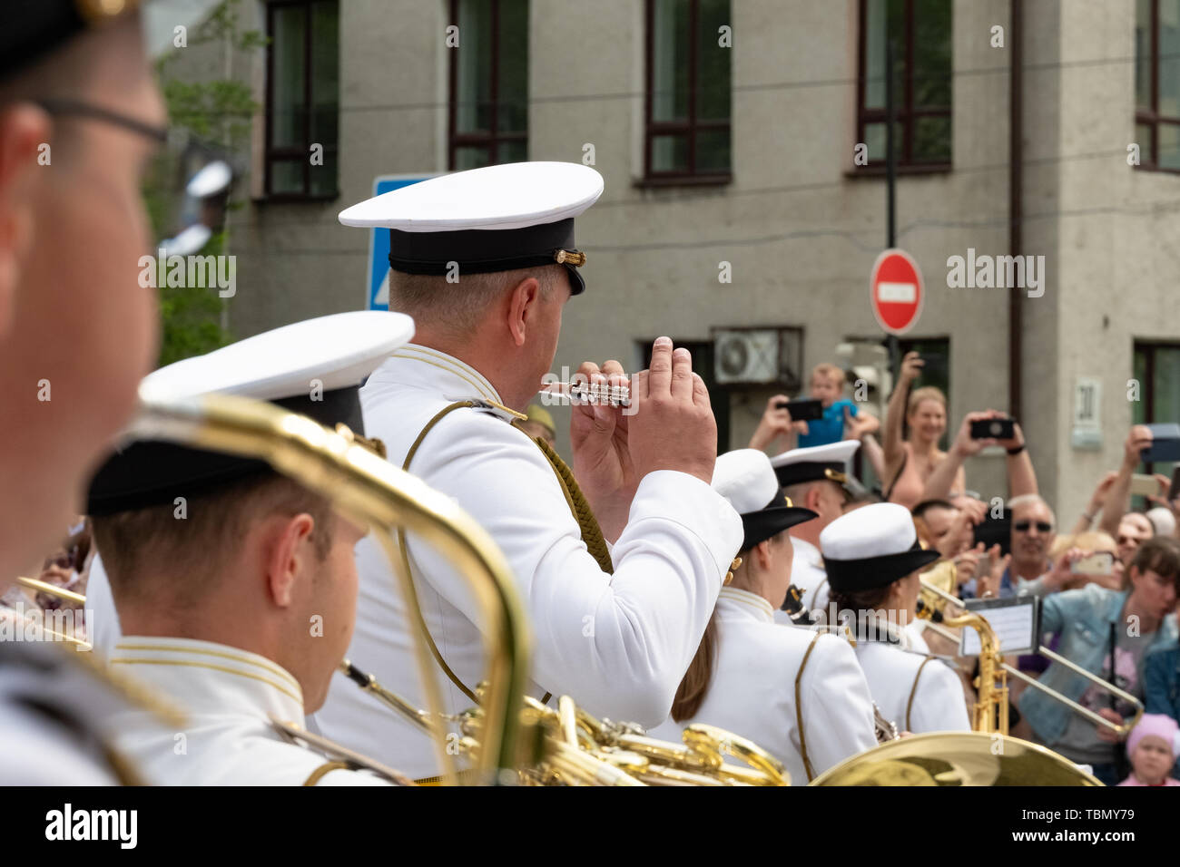 Military music bands marching through the empty streets of the city of ...
