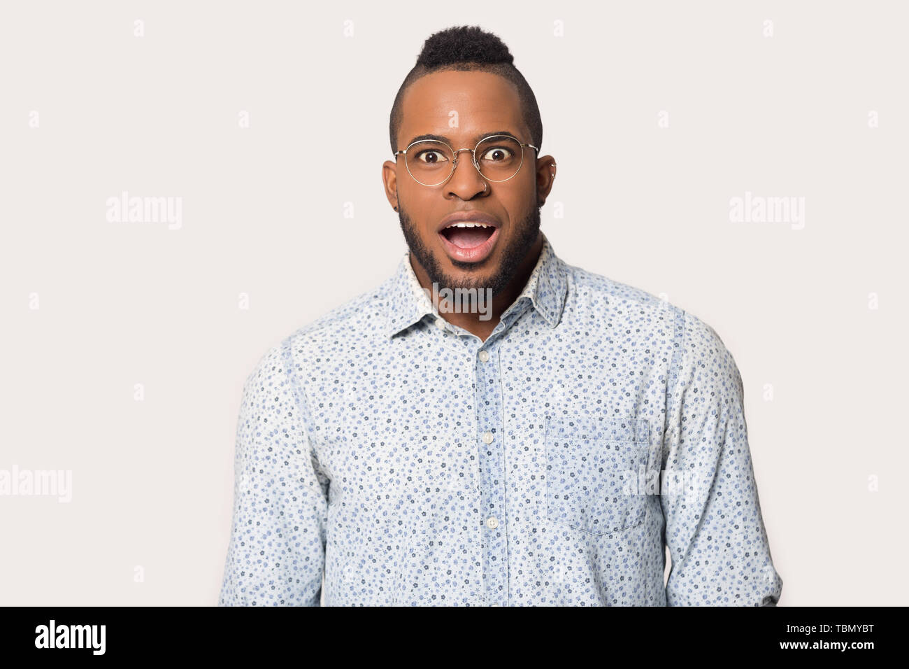 Happy black man isolated point at blank copy space Stock Photo - Alamy