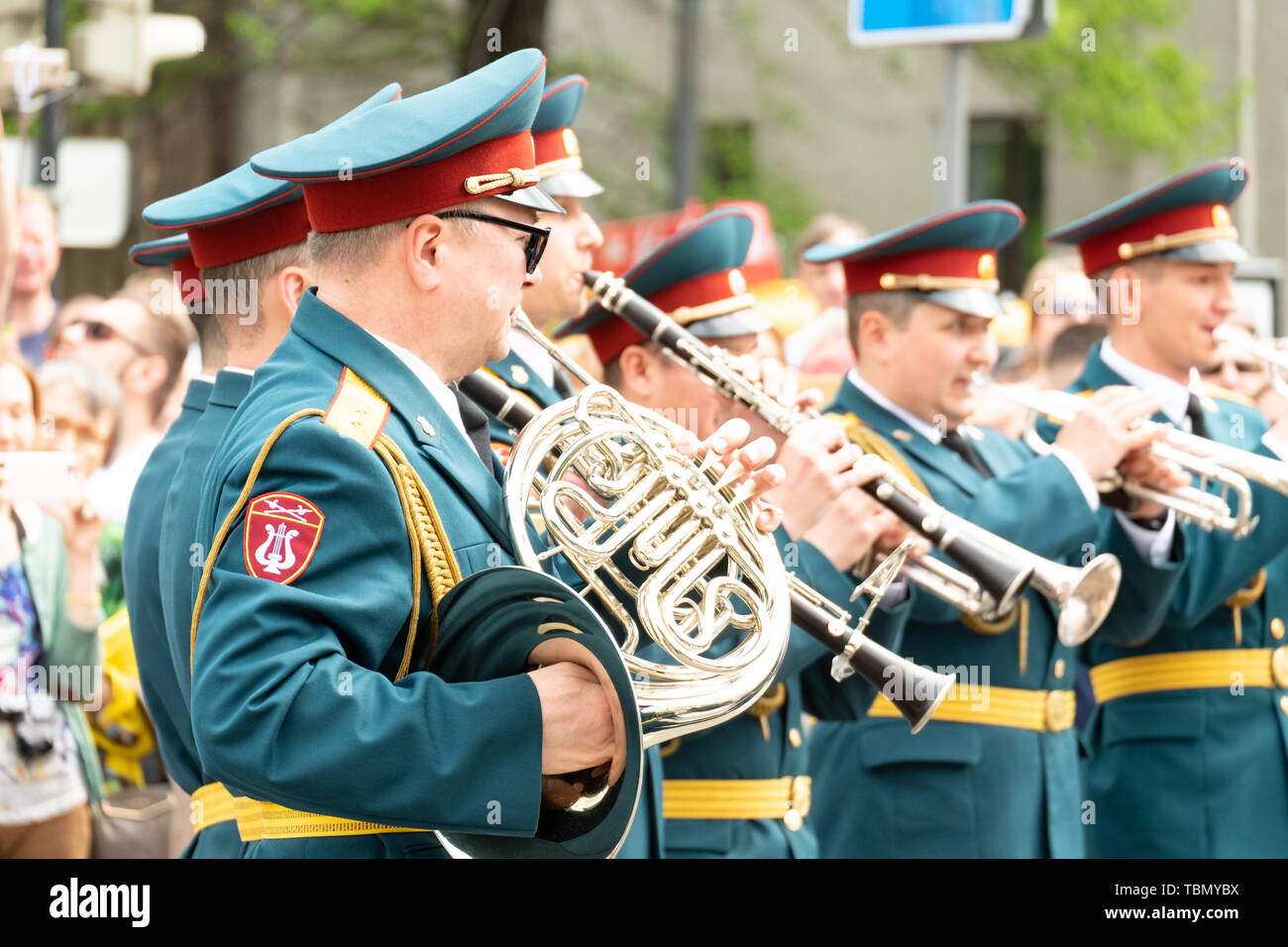 Military music bands marching through the empty streets of the city of ...