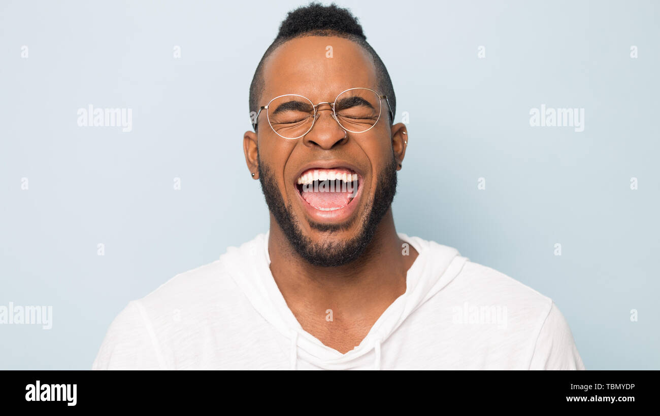 Close up of black man laugh with white toothy smile Stock Photo - Alamy