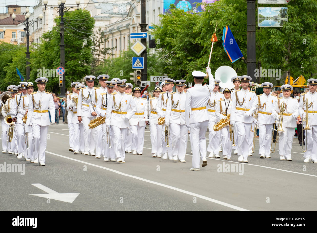 Military music bands marching through the empty streets of the city of ...