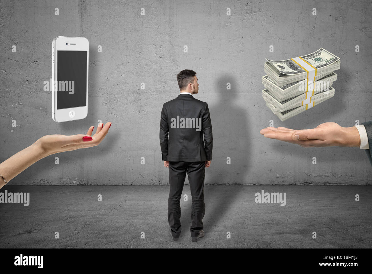Back view of businessman standing between two big hands, woman's hand ...